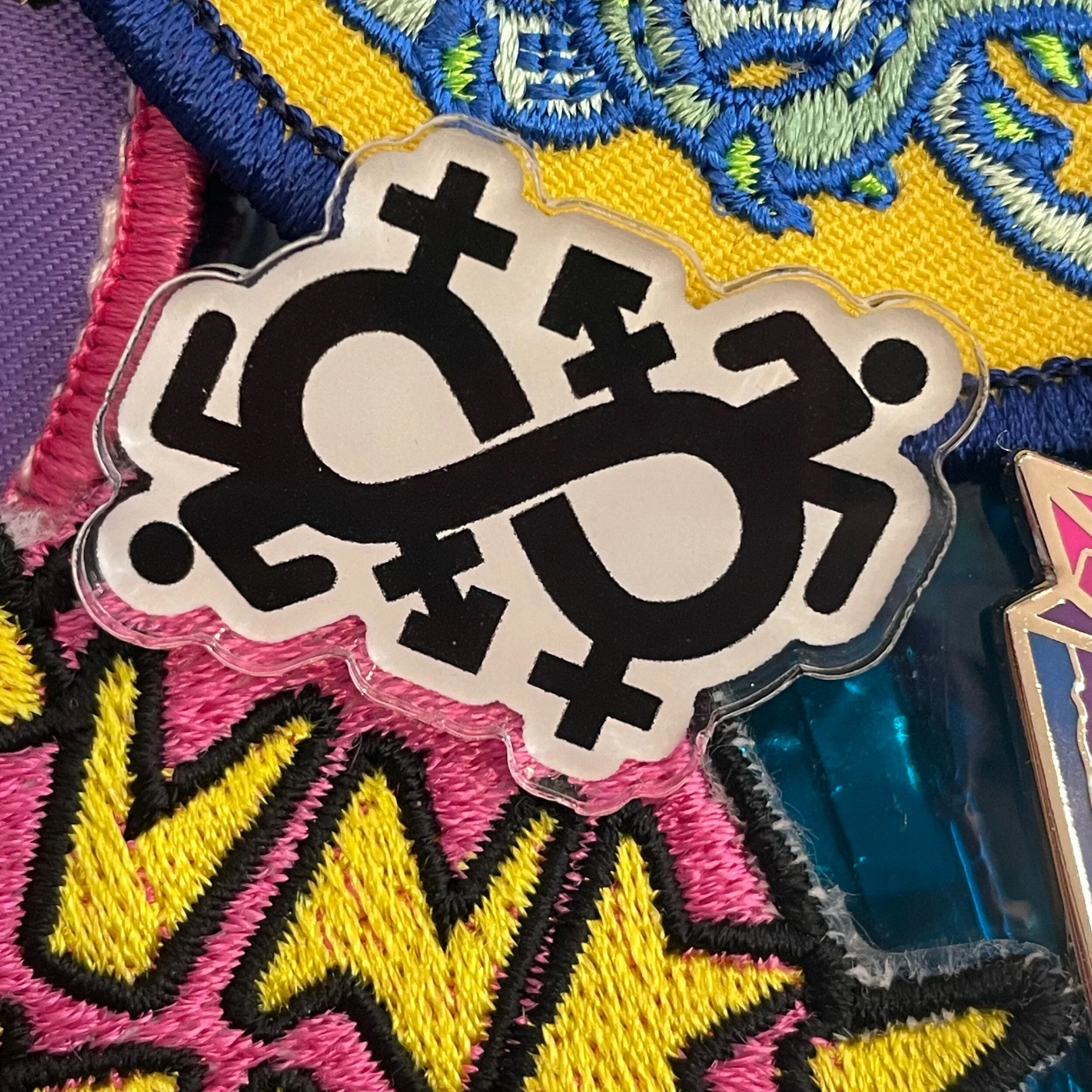 NeuroQueerCrip Acrylic Pin — Rebirth Garments