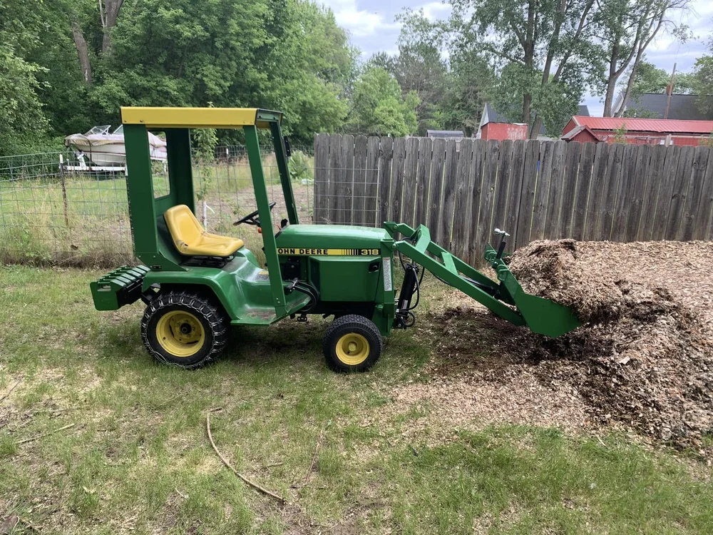 Why the John Deere 318 Is a Legend—And Even Better with a Front-End Loader
