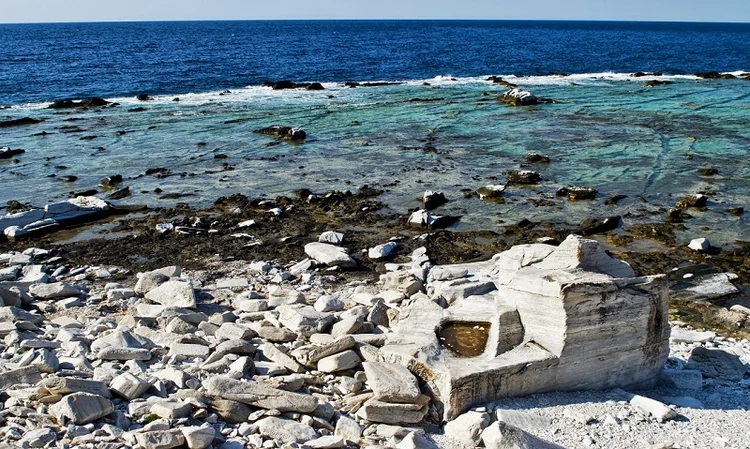 The partially submerged ruins of a white marble quarry used in ancient ...