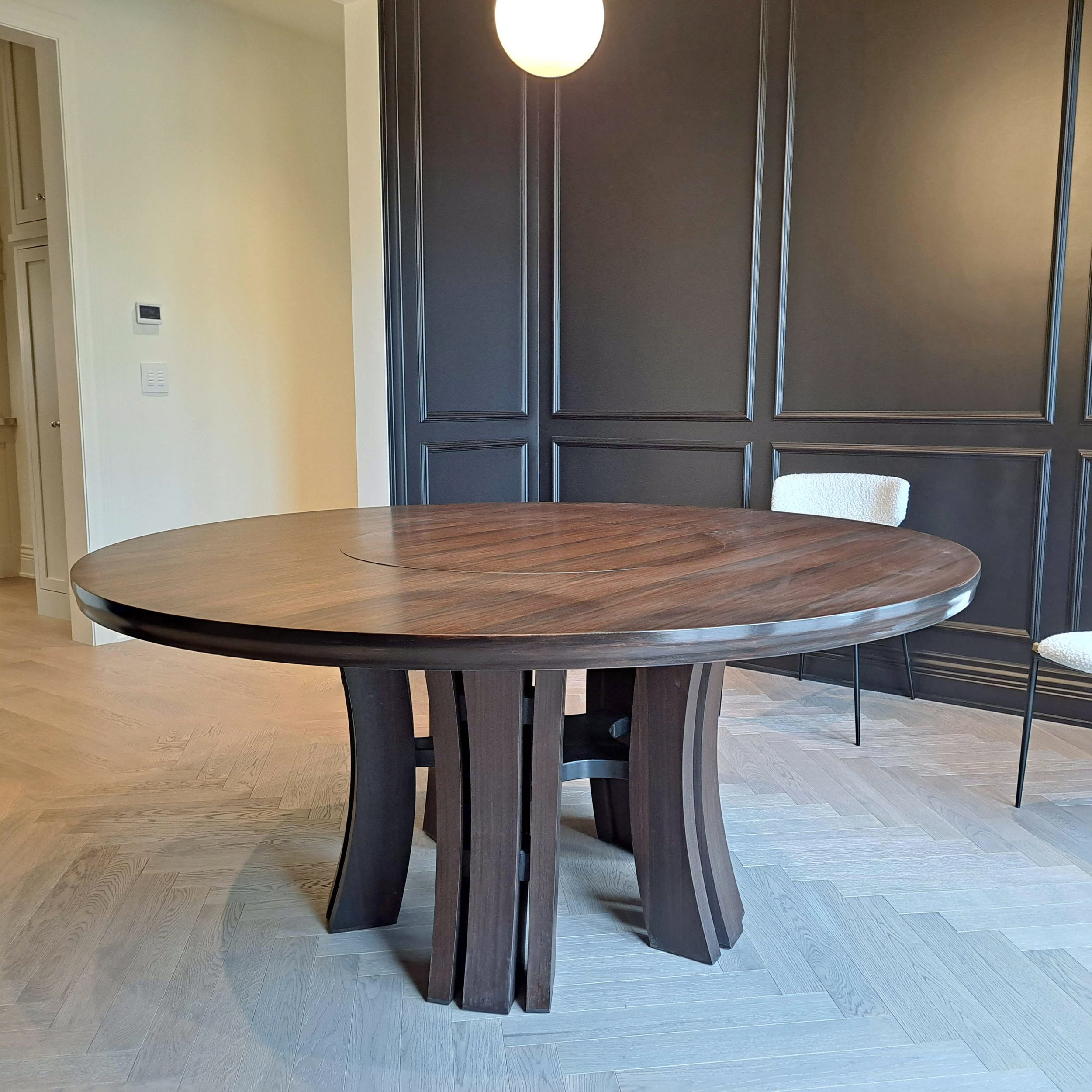 Large round ebony dining table — WoodZest