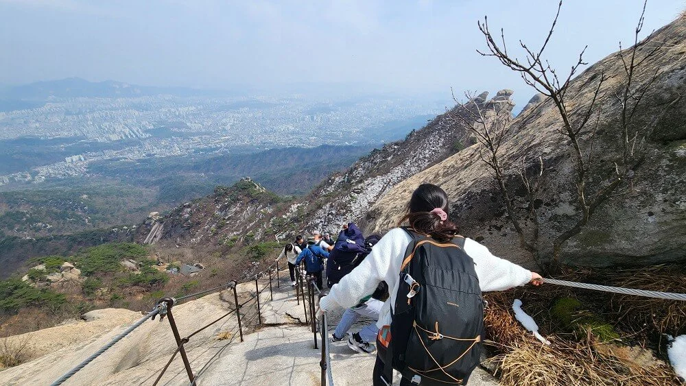 hiking up bukhansan mountain in seoul