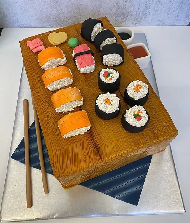 A Gold Ornament and White Lace Wedding Cake and a Tinga Tinga Art ...