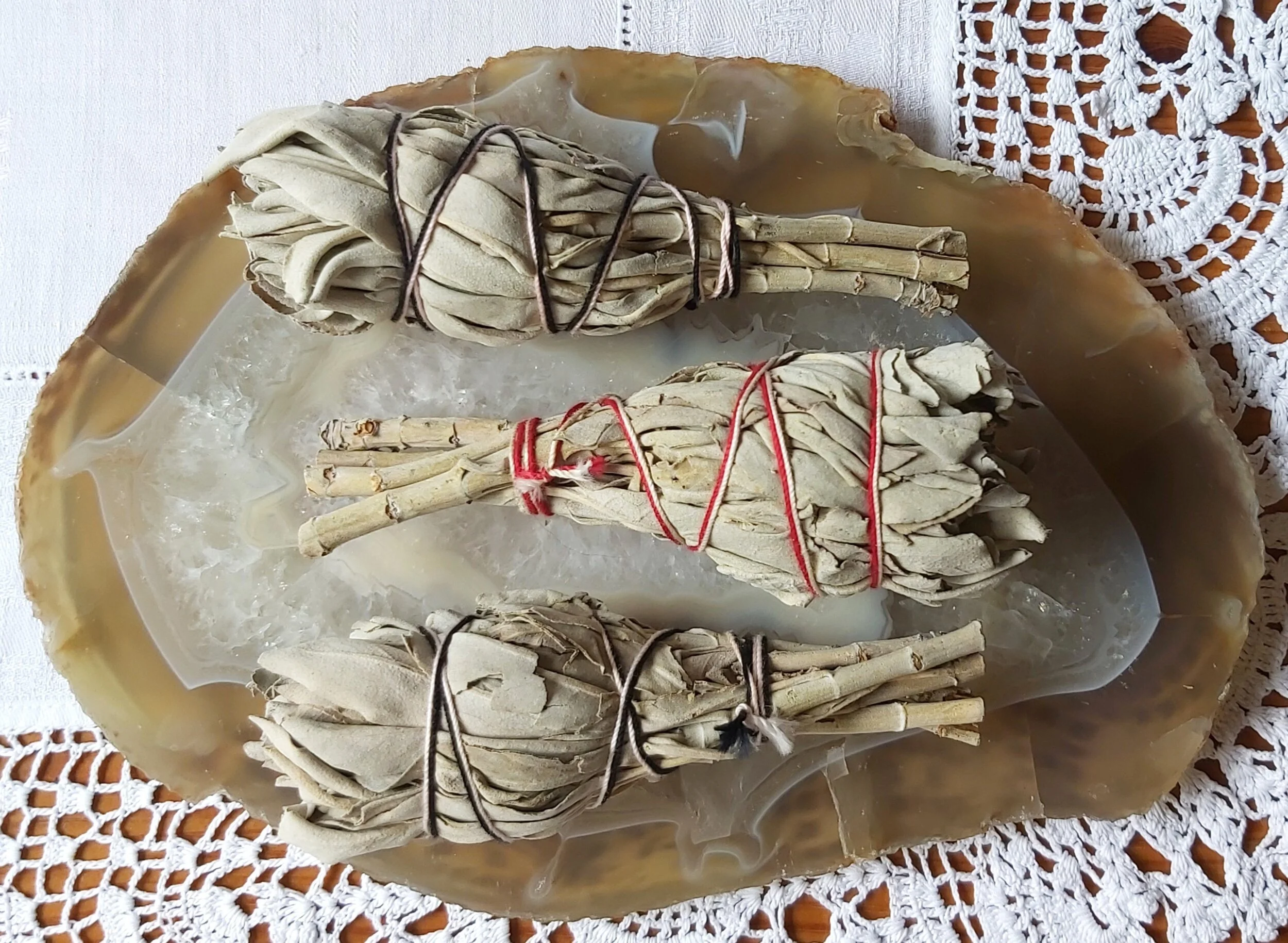 Smudging herbs, sage, abalone shells and feathers-sue weaver