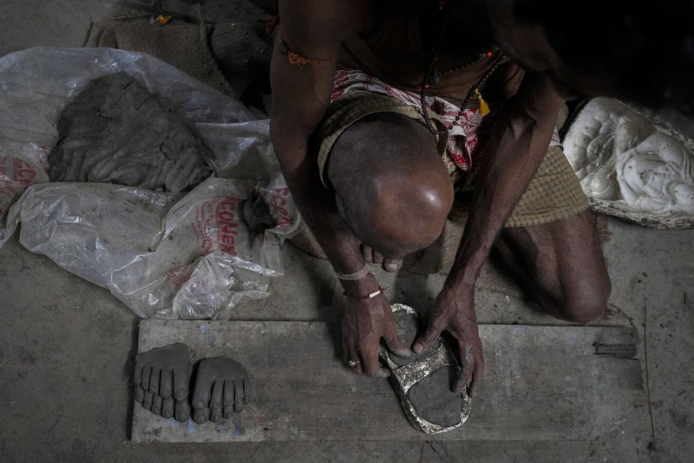 Artisans in India’s Assam state make colorful mud idols of Hindu gods ...