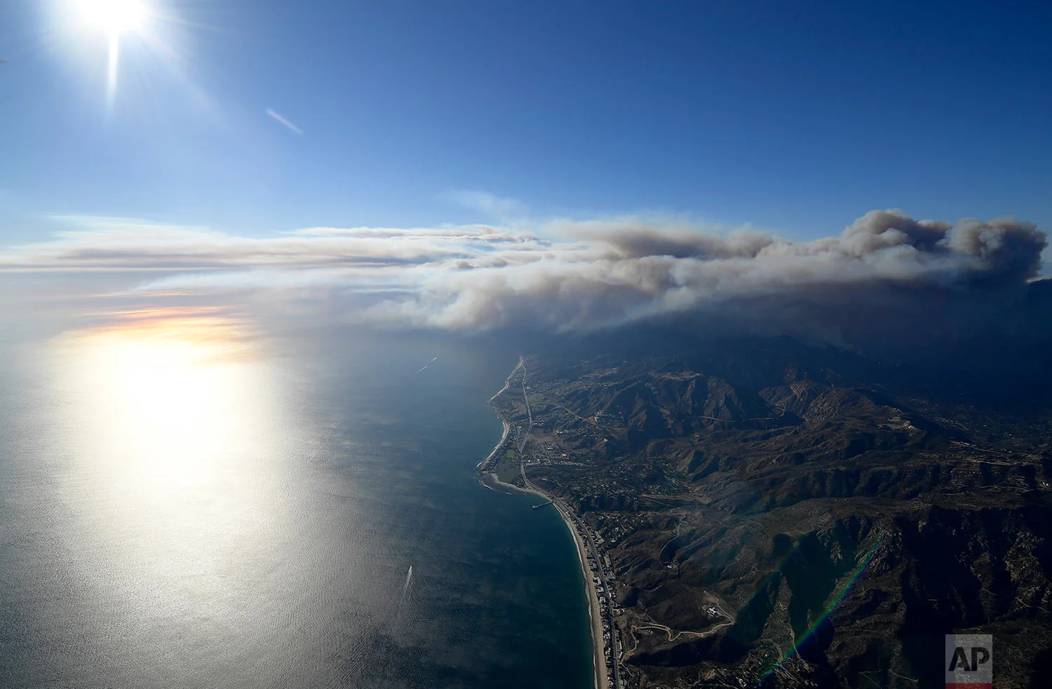 Photos show devastating wildfires on both ends of California — AP Photos