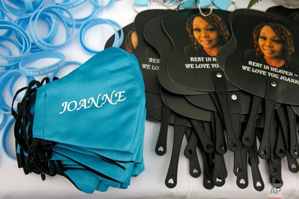 Funeral delayed: tiaras, white outfits, turquoise face masks — AP Photos