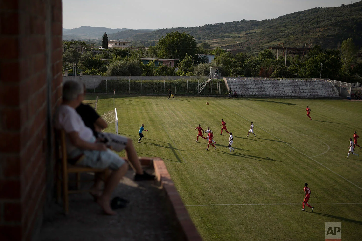 Unemployed at home, Albanians wait to leave — AP Photos