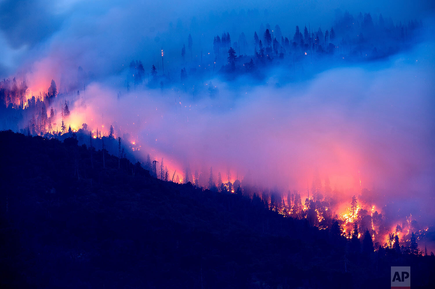 Wildfires race through dry, windy California — AP Images Spotlight