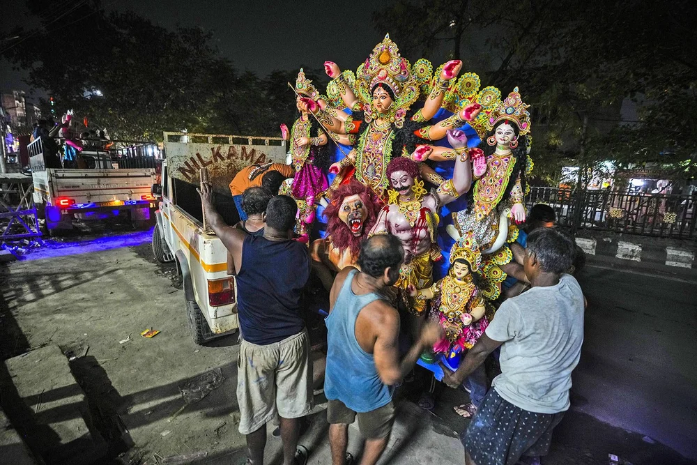 Artisans in India’s Assam state make colorful mud idols of Hindu gods ...