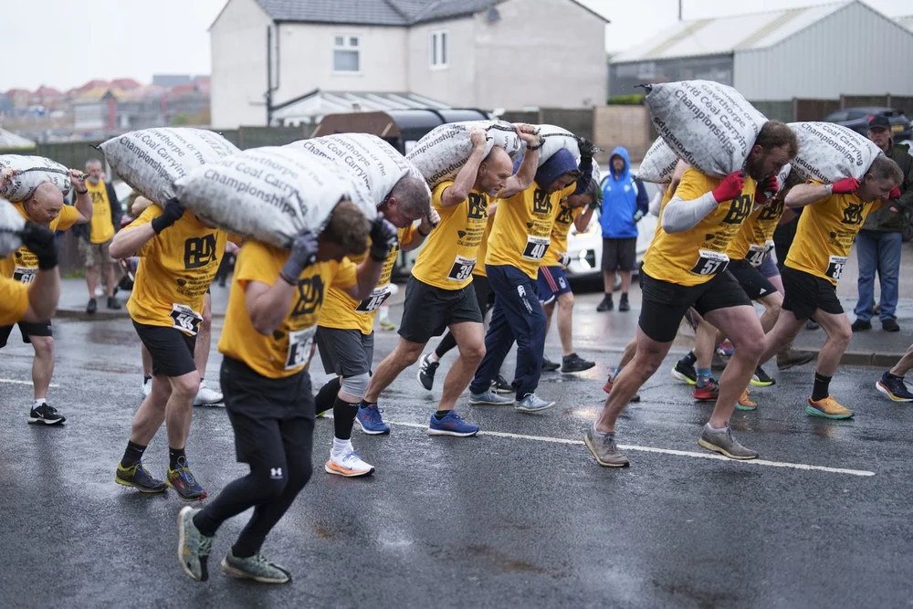 Contestants haul heavy sacks of coal in unusual Yorkshire tradition ...