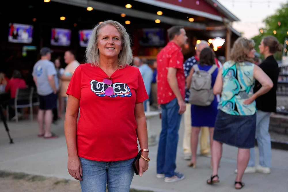 Americans watch Trump and Biden in election debate — AP Photos