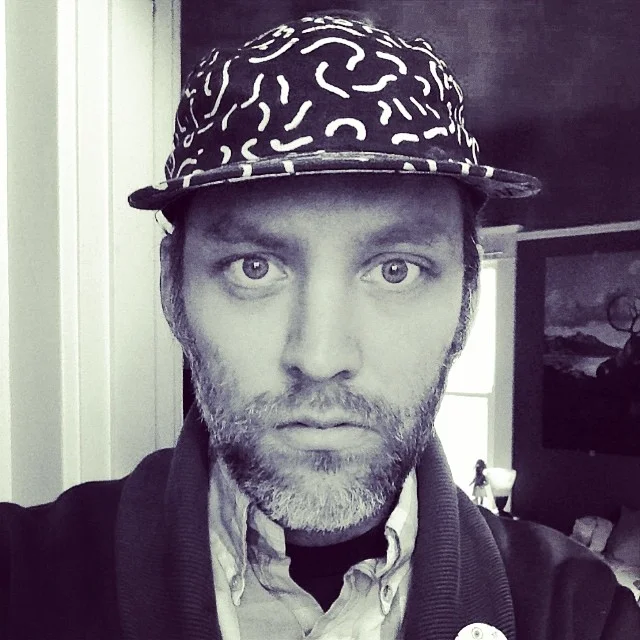 ABOUT — NICHOLAS HANS