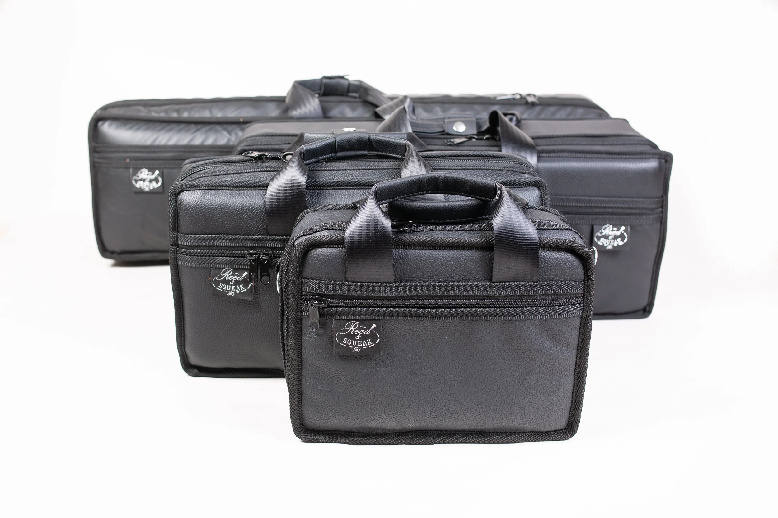 Reed and Squeak cases-Reed and Squeak cases and musical instruments