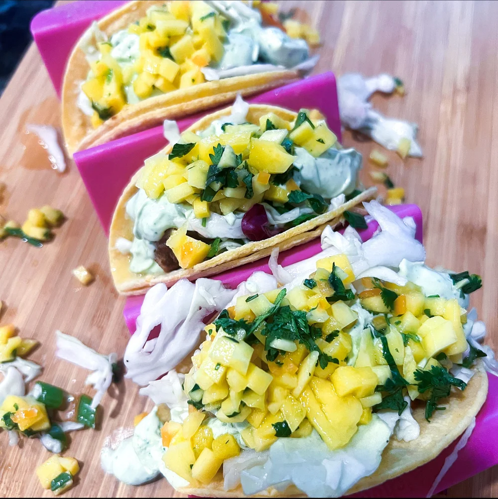grilled yellowtail tacos with quick slaw, avocado crema, and mango ...