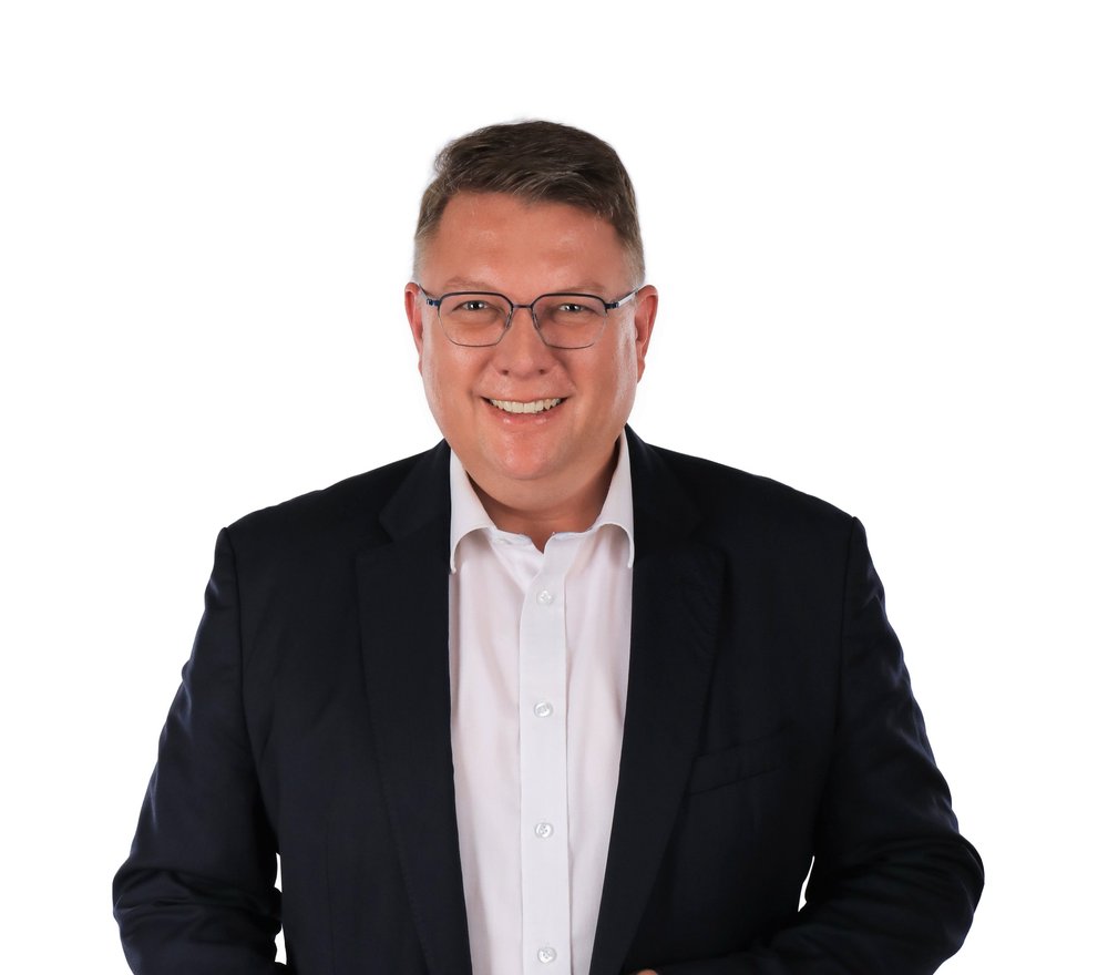 Profile — Dr. Nigel Wilson