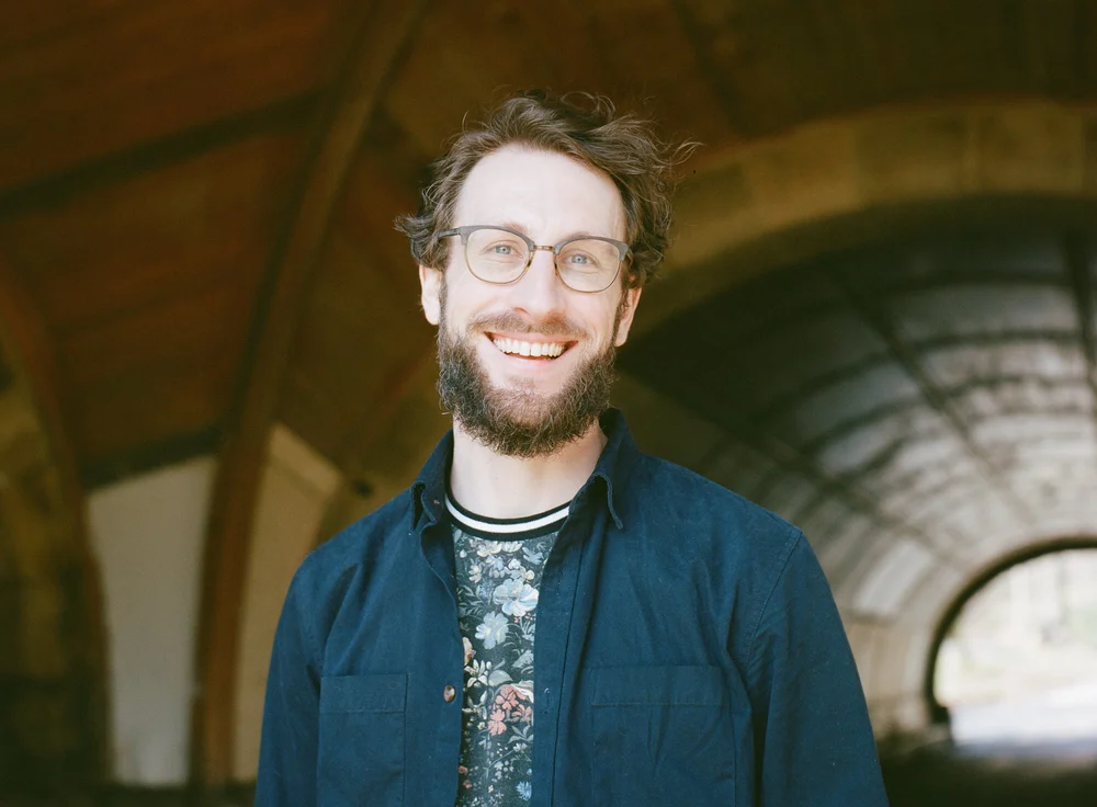 Director Bio — Tom Costello