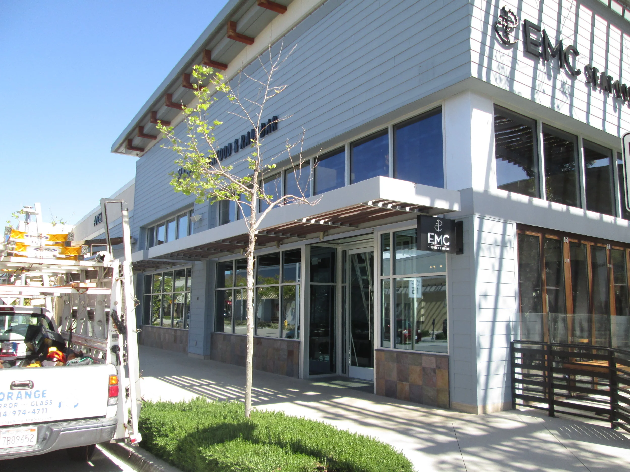 Storefronts — Orange Mirror and Glass