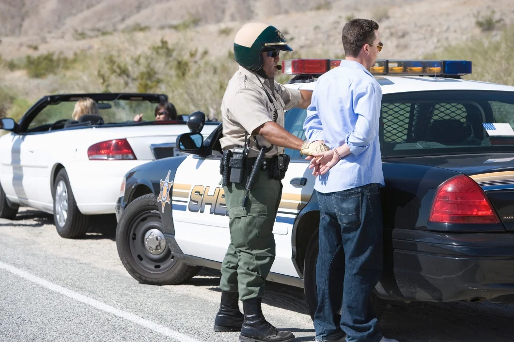 Police Officers Arresting Someone