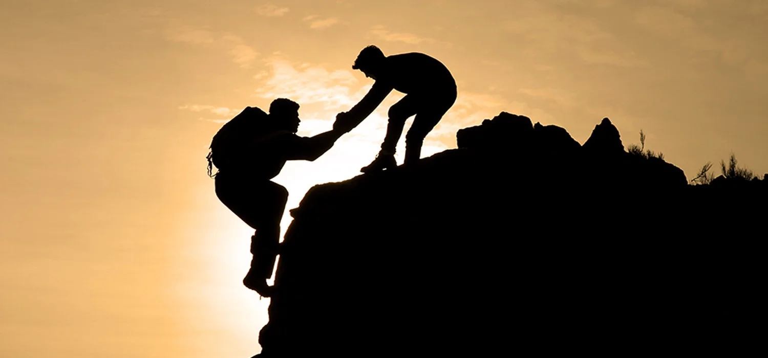 Person Helping Someone Up