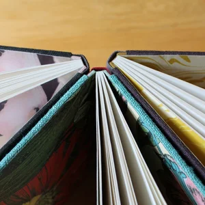 a small trio with print endpapers — paperiaarre