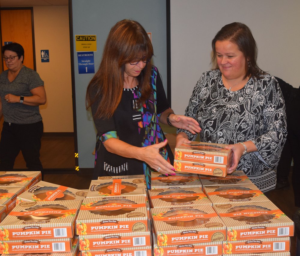 The gift of giving: Volunteers assemble Thanksgiving baskets for ...