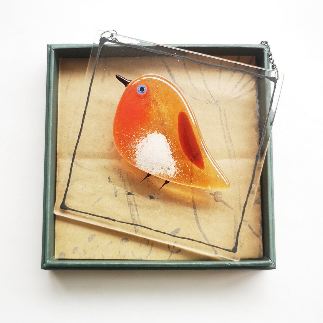 A fused glass robin memorial in the form of a glass picture to hang on ...