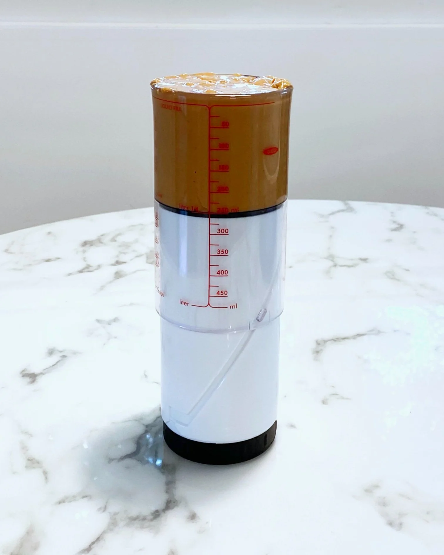 This Push-Pop Measuring Cup is Absolutely Ingenious — This You Need