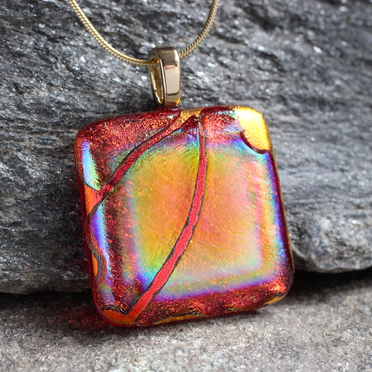 pink diamond ghost dichroic 1-3/8” glass pendant with an 18” sterling ...
