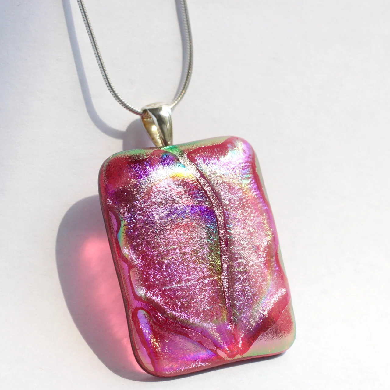 pink diamond ghost dichroic 1-3/8” glass pendant with an 18” sterling ...