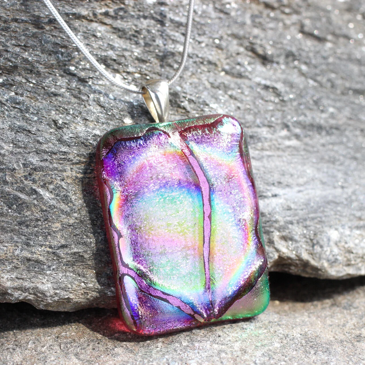 pink diamond ghost dichroic 1-3/8” glass pendant with an 18” sterling ...