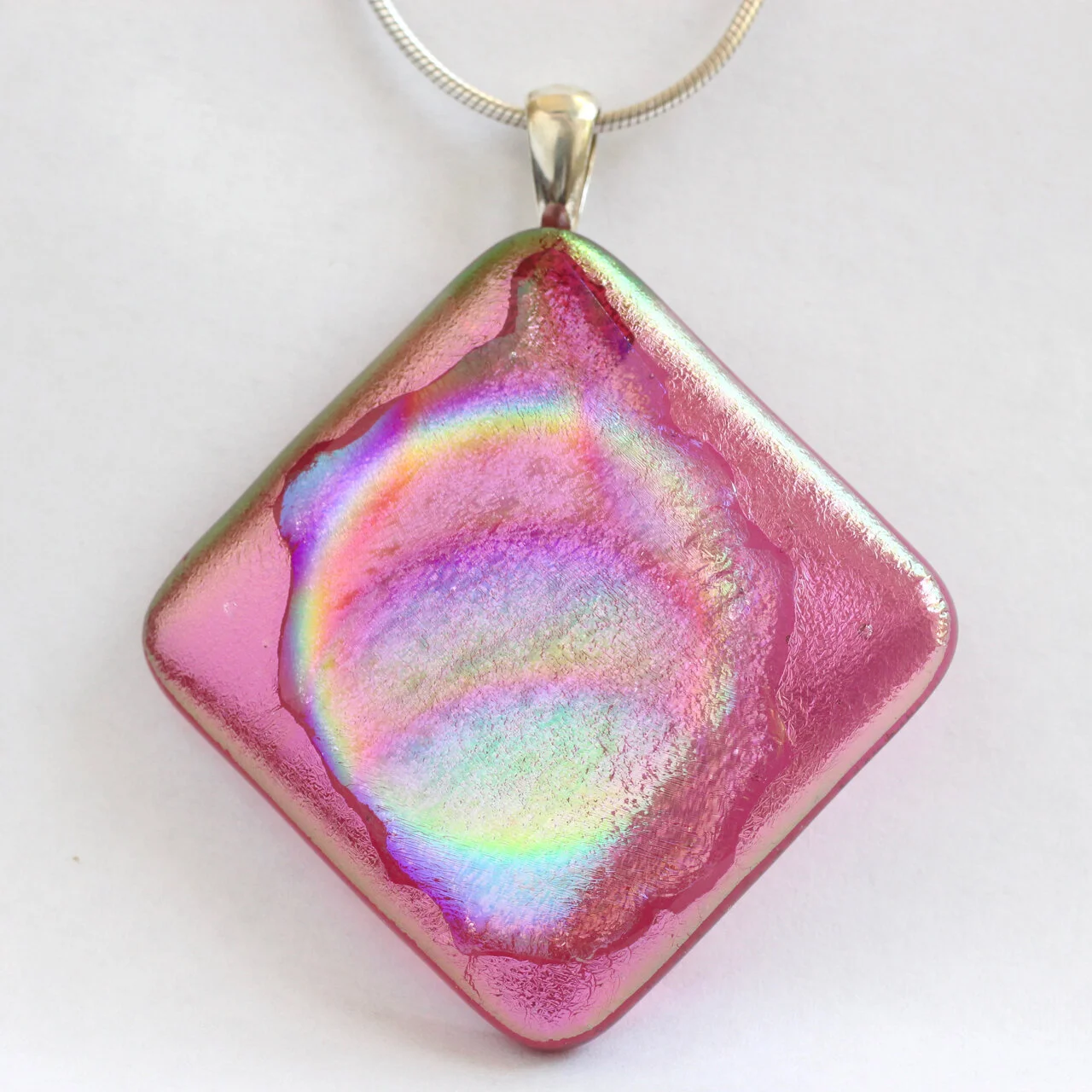 pink diamond ghost dichroic 1-3/8” glass pendant with an 18” sterling ...