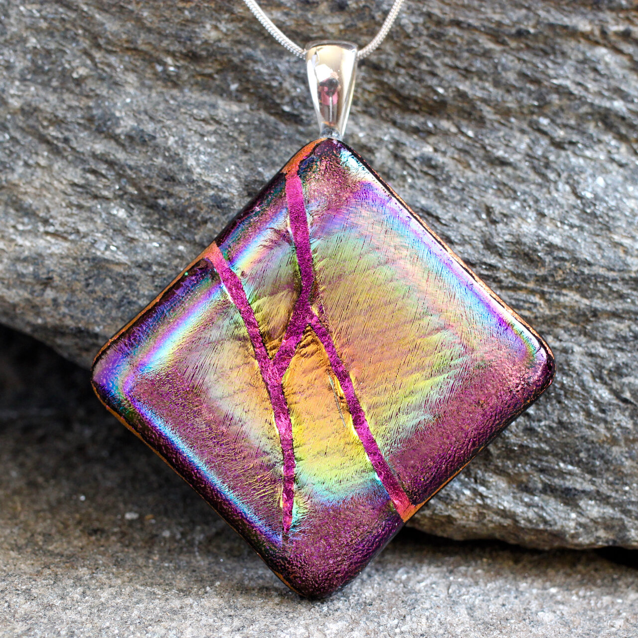 red confluence opaque dichroic 1-5/8” glass pendant with an 18 ...