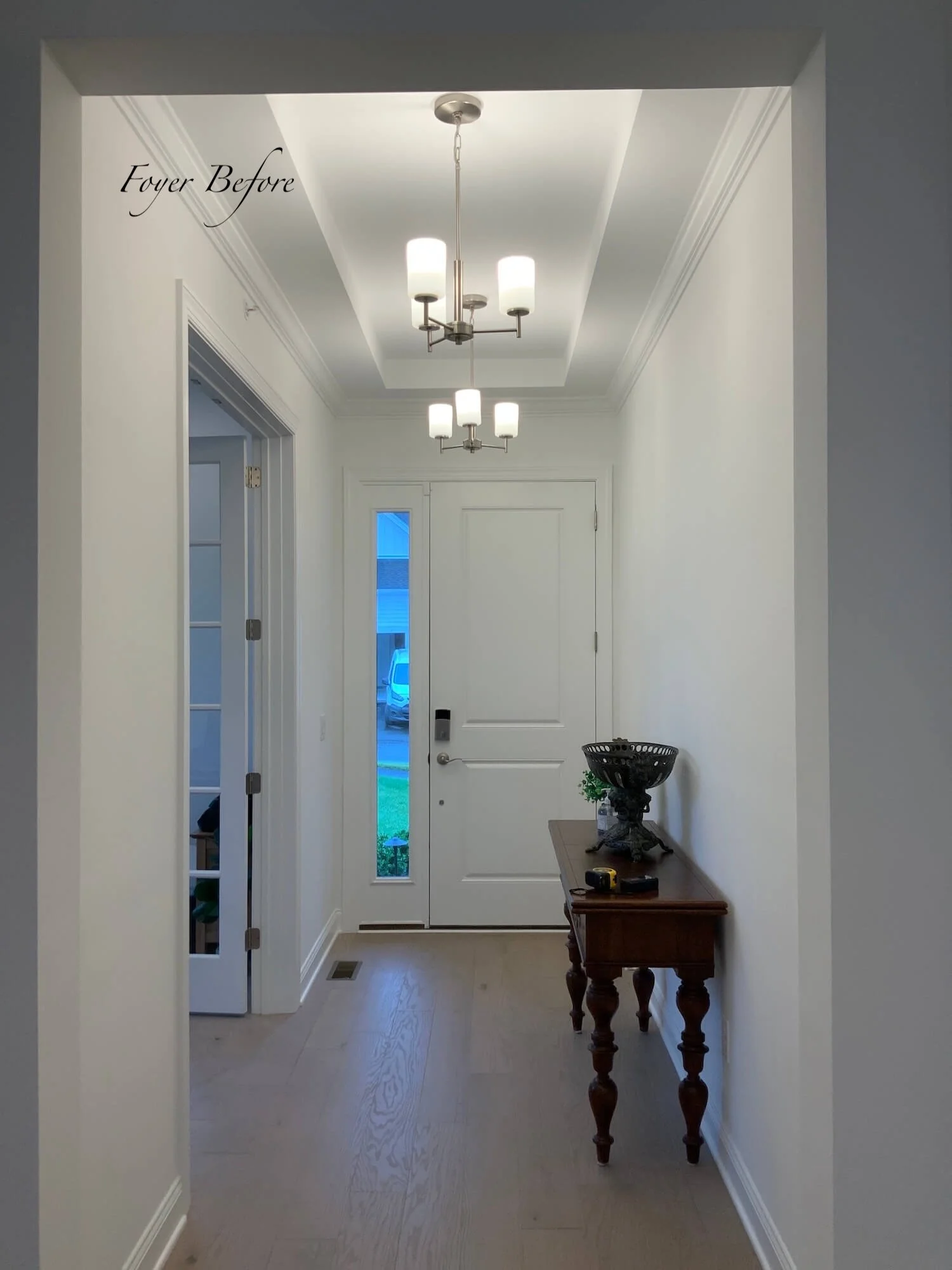 JRL Interiors — Foyer Transformation: from builder basic to elegant