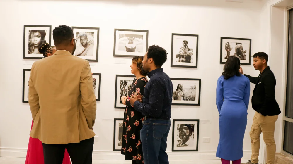 People Looking At Art In Gallery