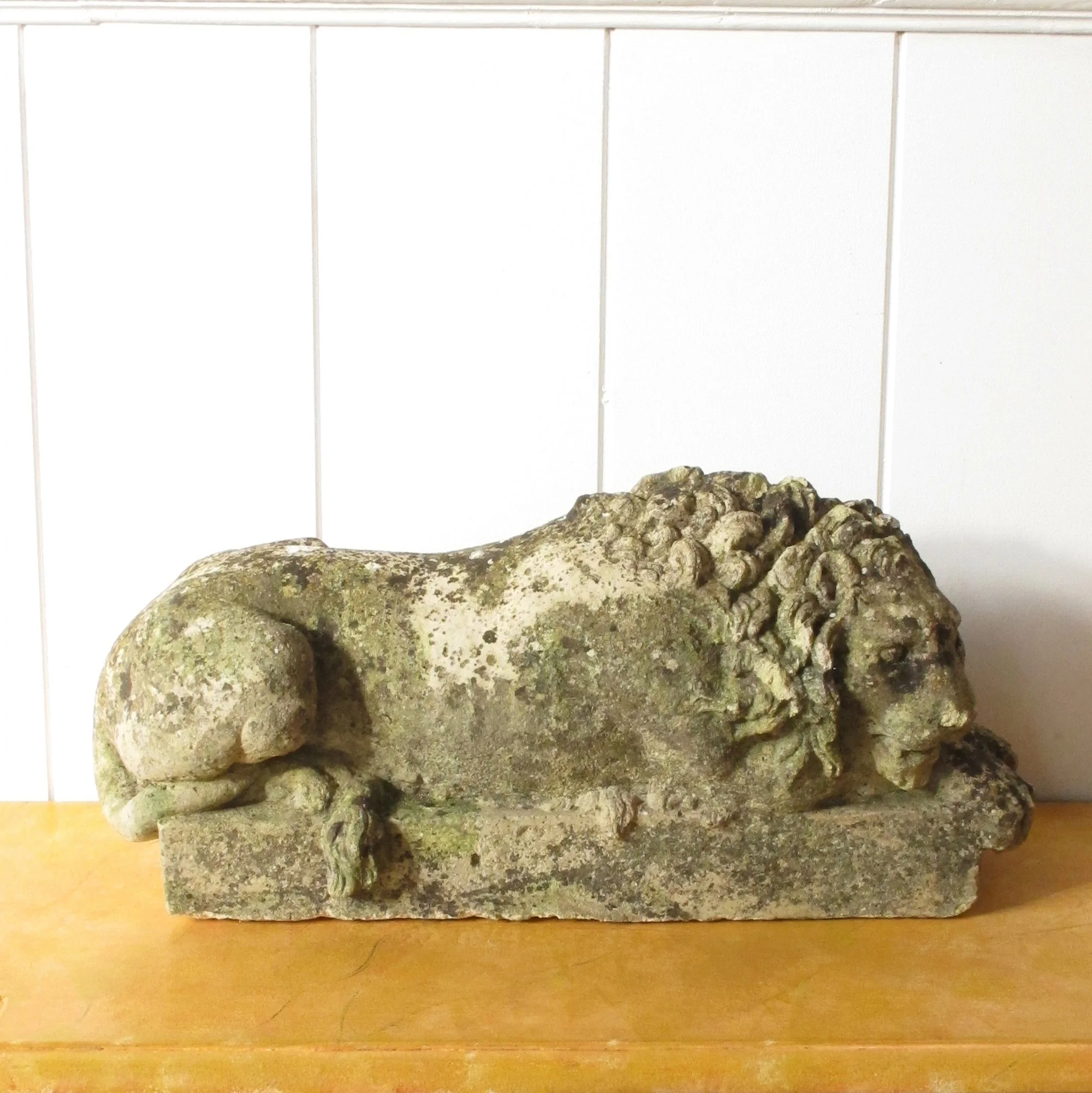 Stone recumbent lion — fat city