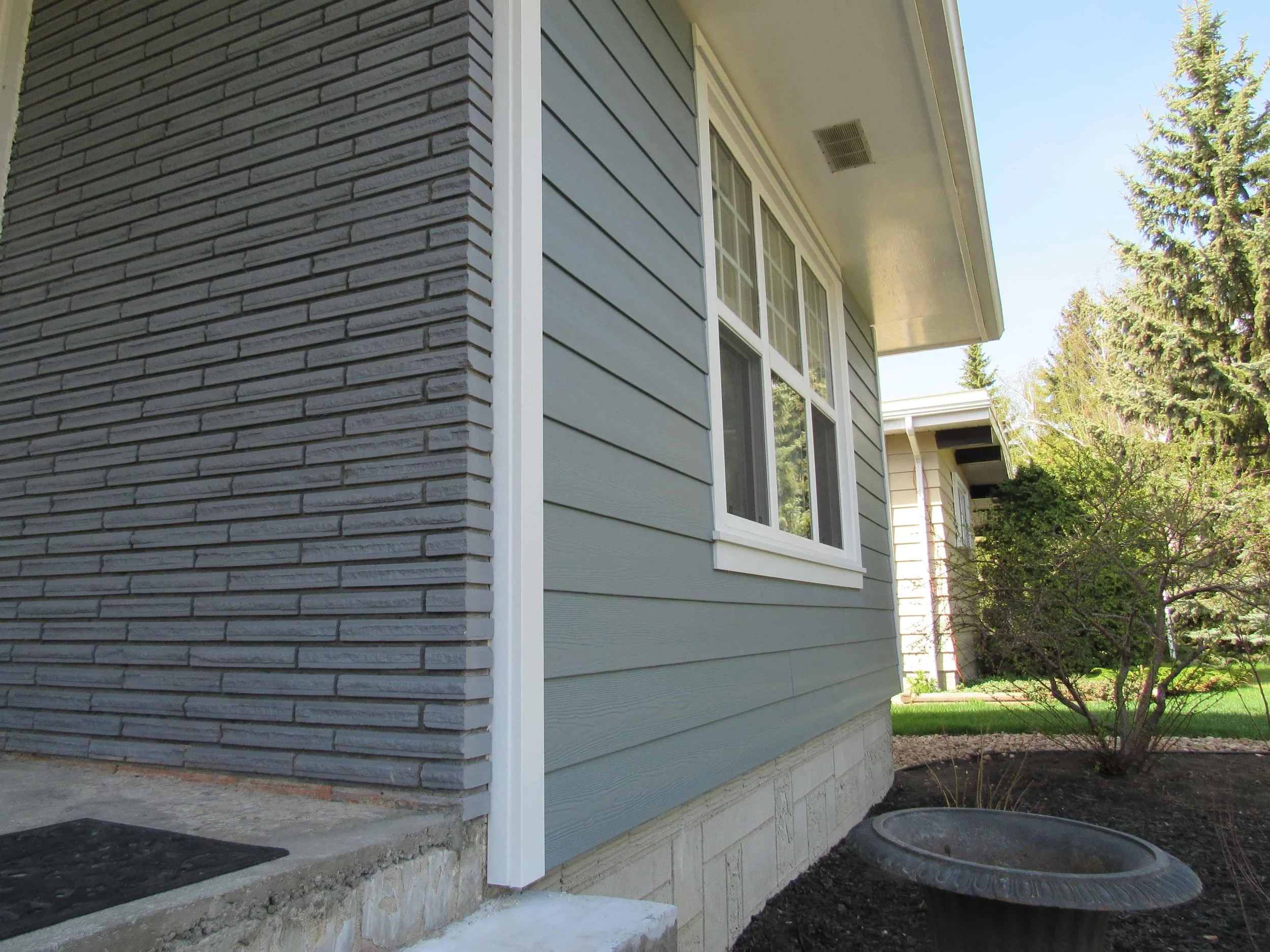 Hardie Over Stucco Renovation — Blue Jay Exterior Renovations