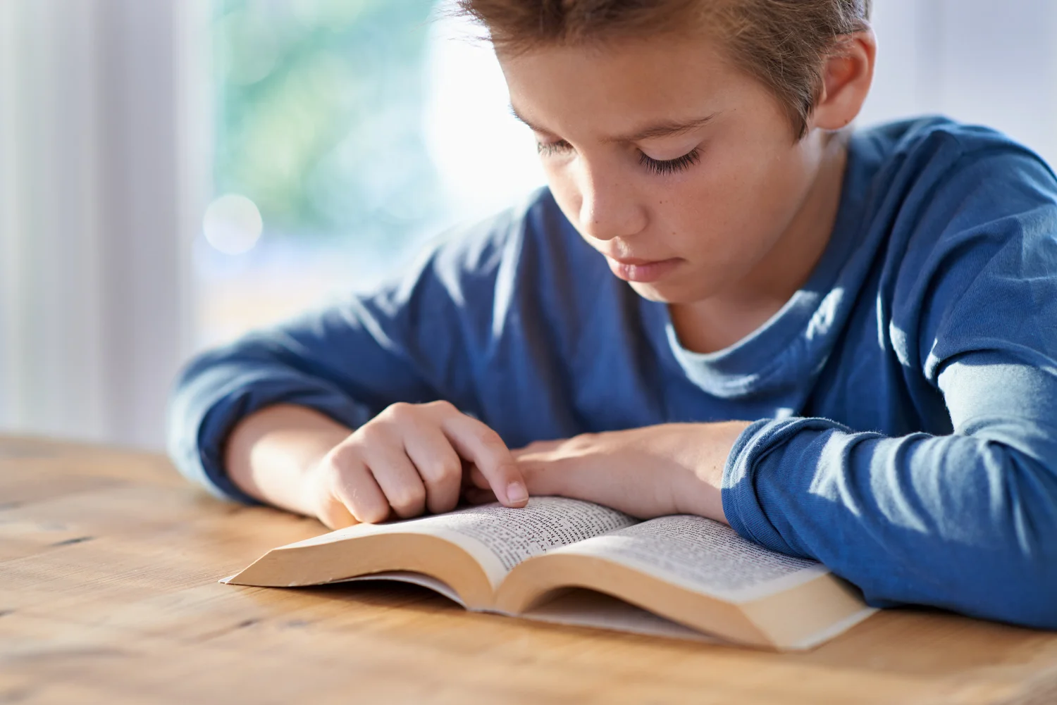 Child Reading A Book