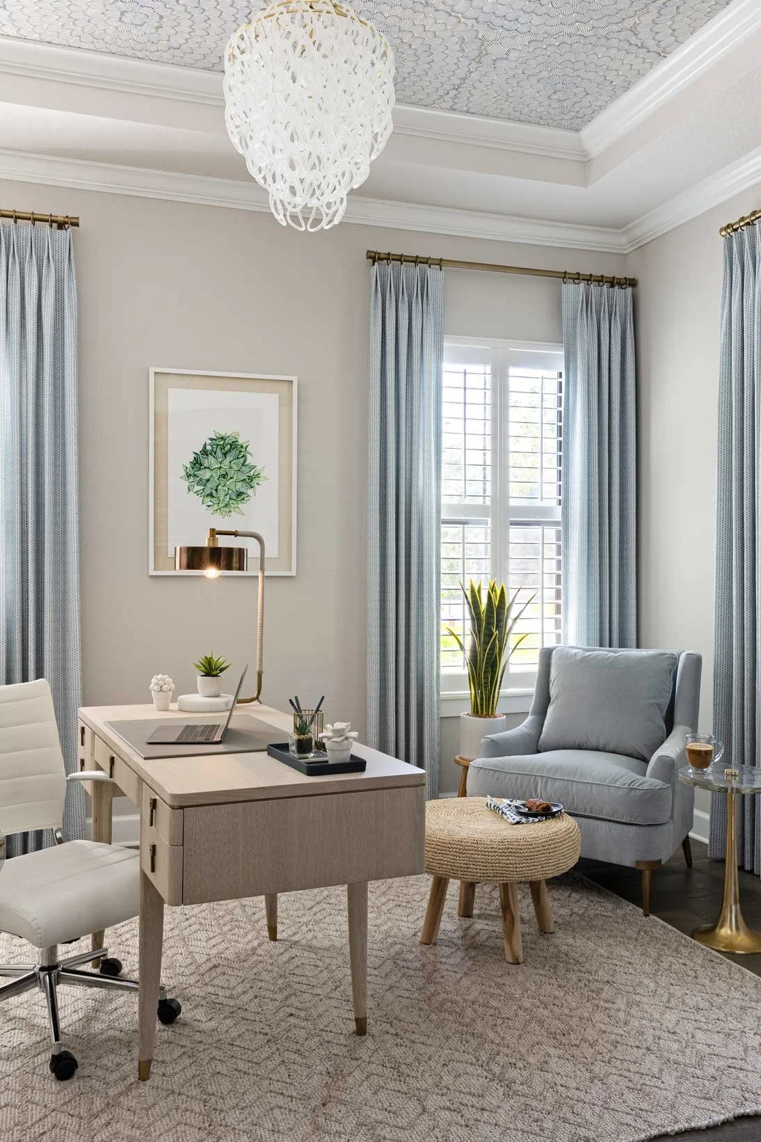 Unique lighting, textural wallpapers, and furnishings update this basic builder home | Bee Studios