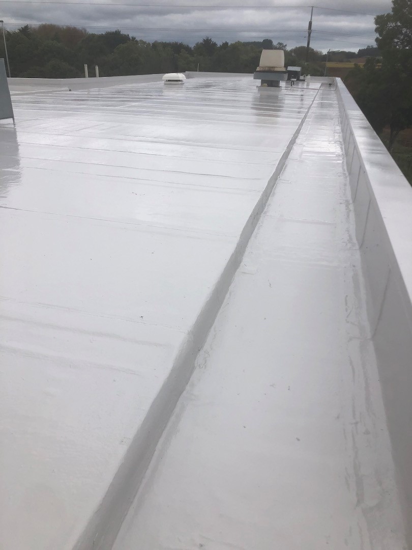 Flat Roofs — Seamless Coatings