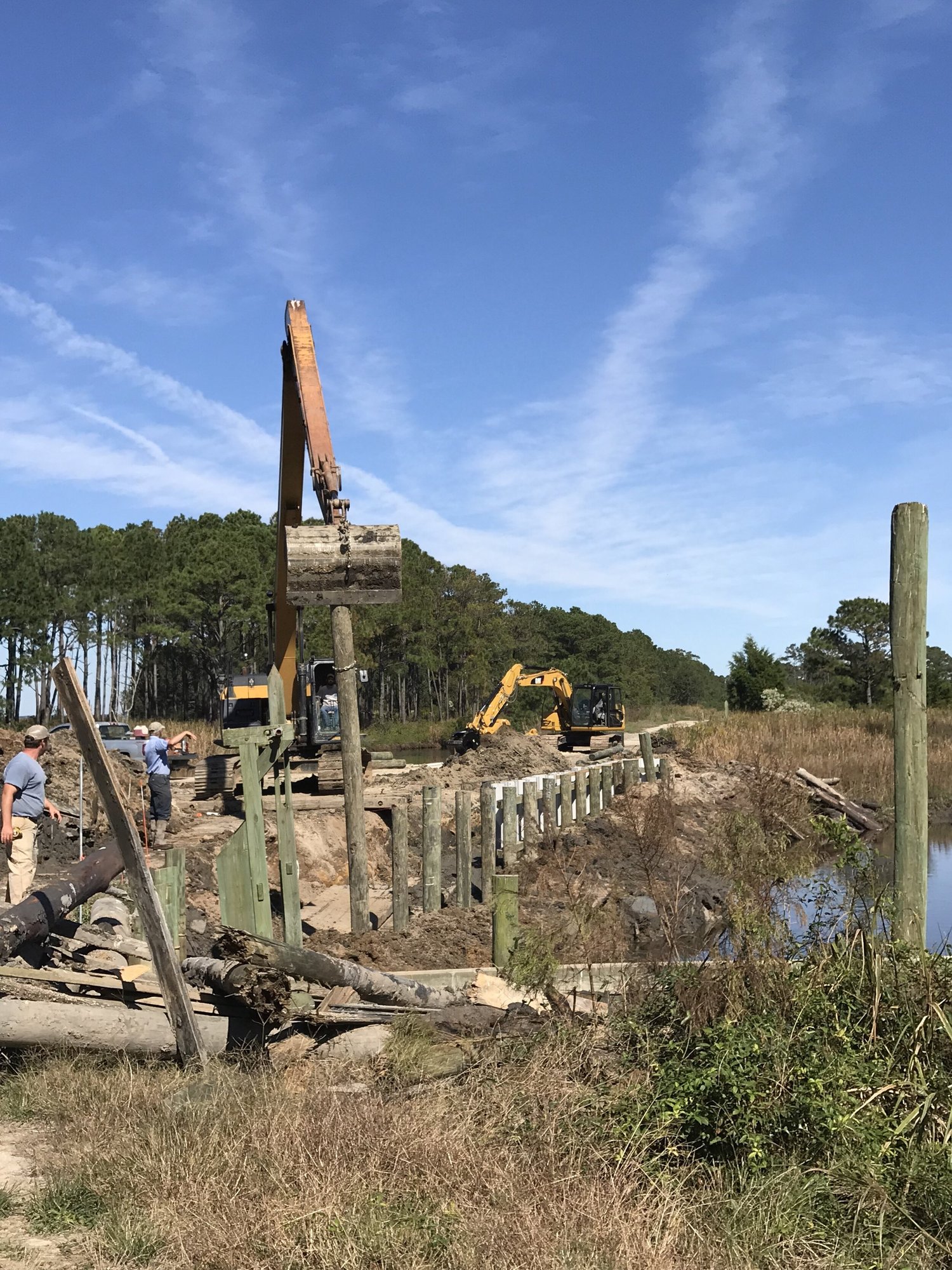 Photo gallery of dike work, seawall construction, and paving, grading ...