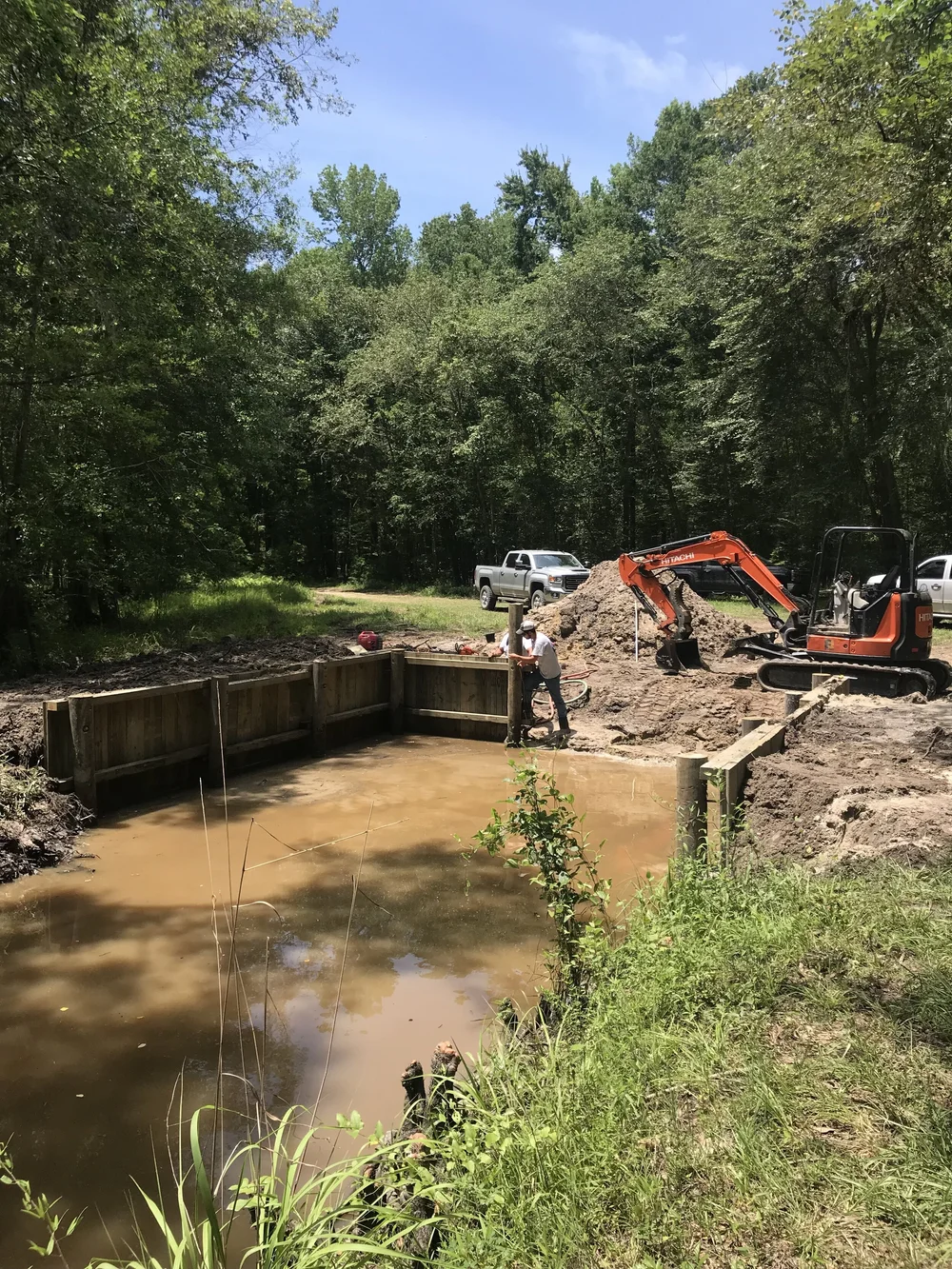 Photo gallery of dike work, seawall construction, and paving, grading ...