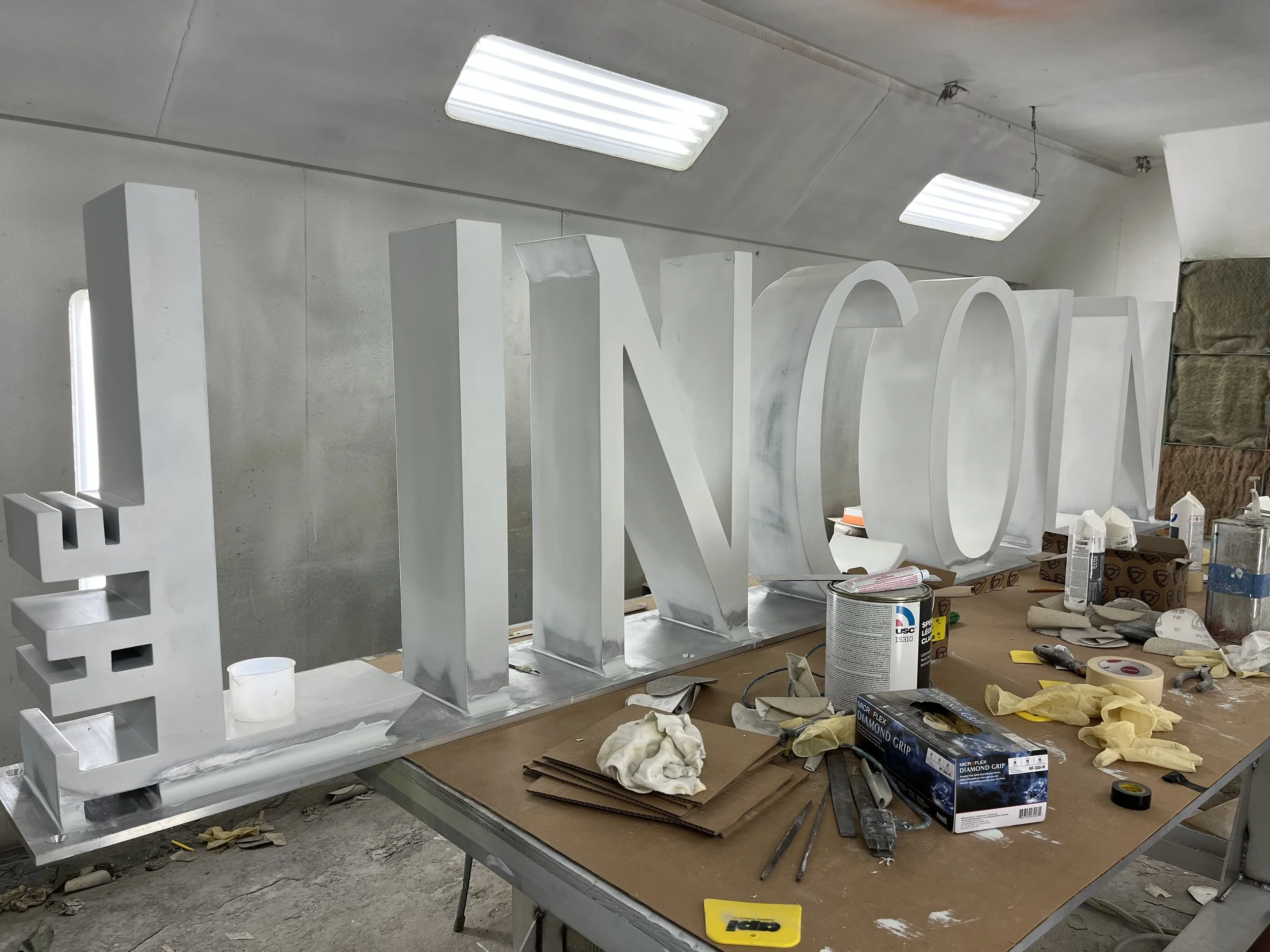 FABRICATION — SIGNATURE SIGN COMPANY