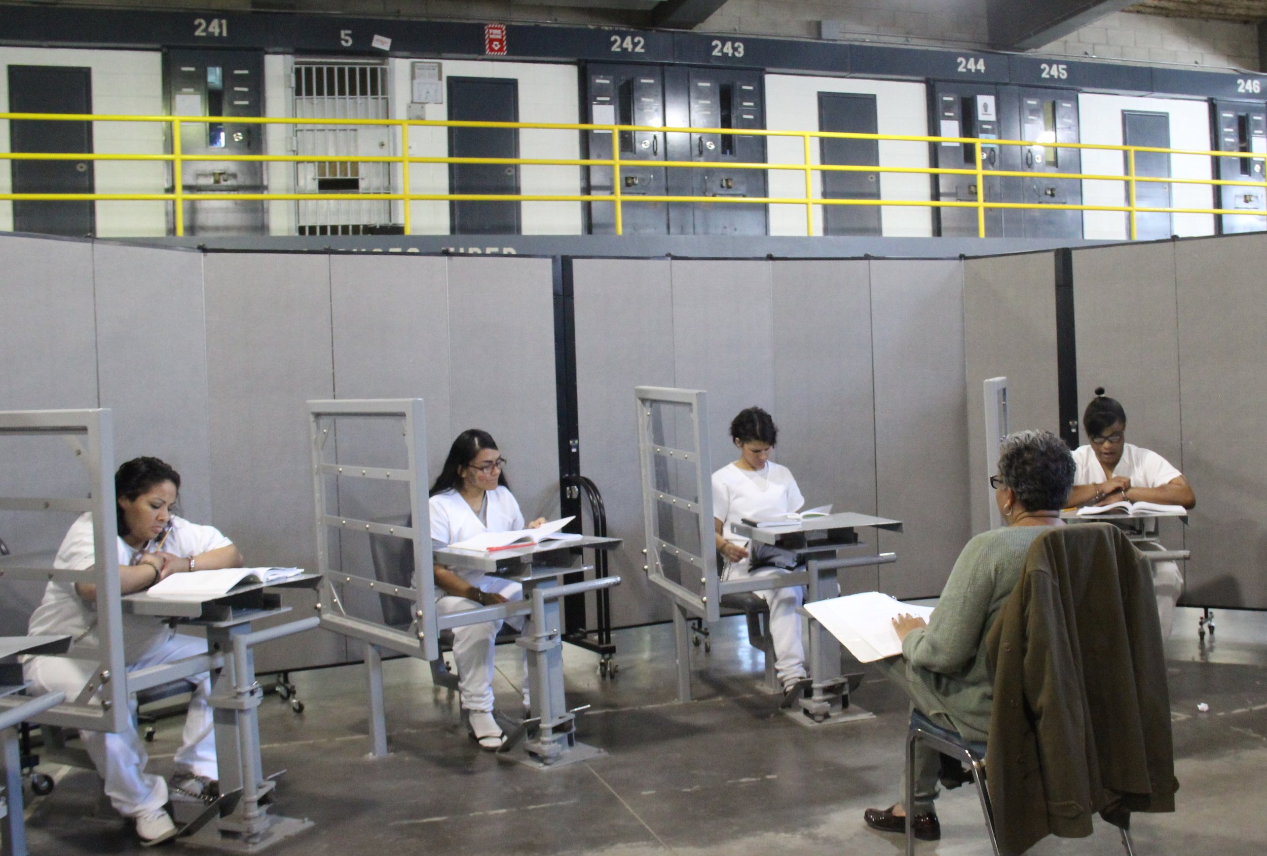 Chained to desk? Group photo in long ass chains? : r/Prison
