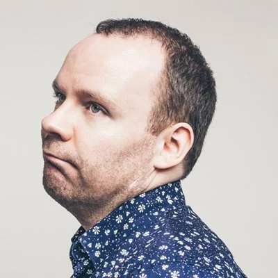 About — Neil Delamere