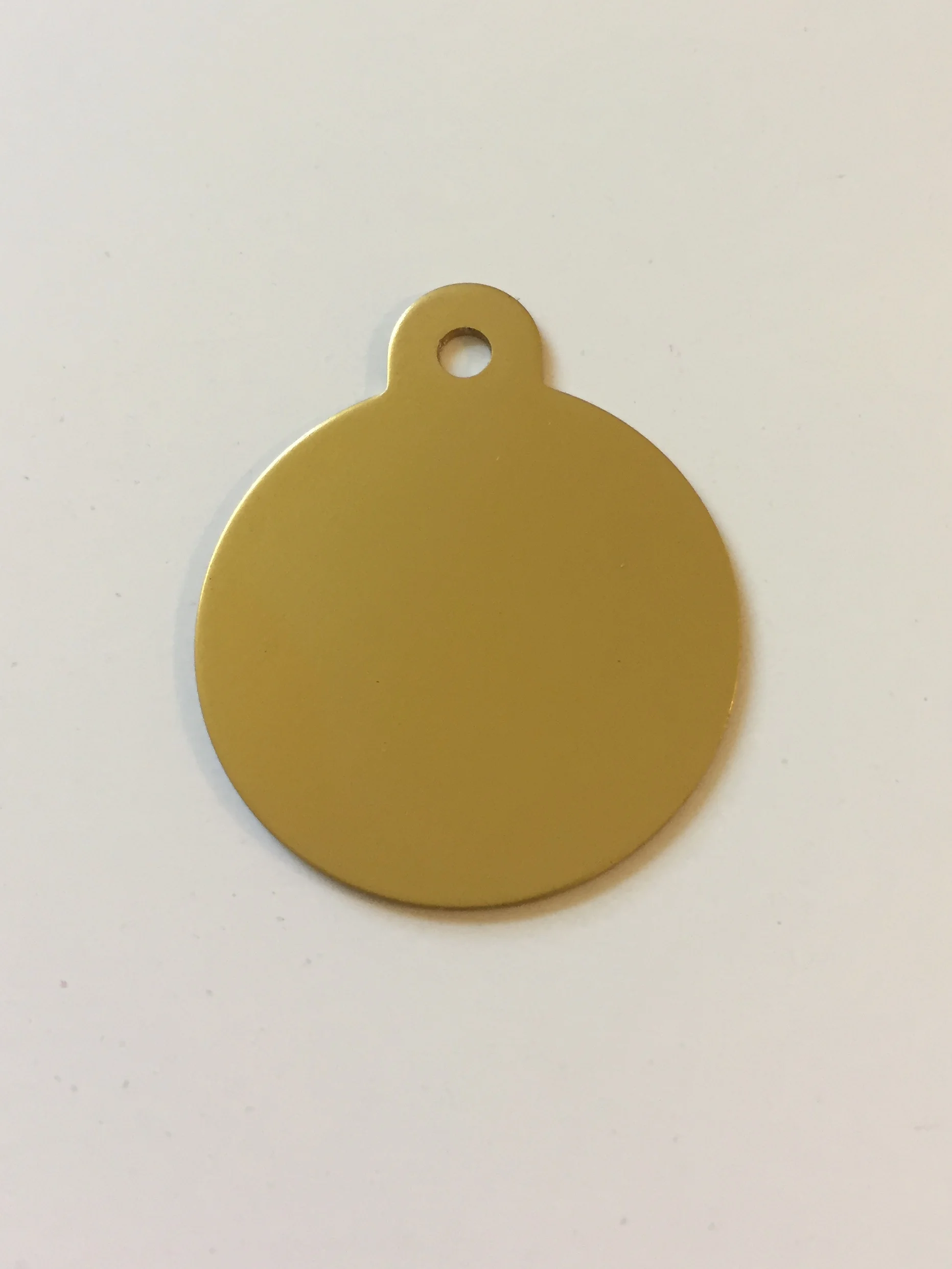 Large Gold-toned Circle — Mary Ann Dituro