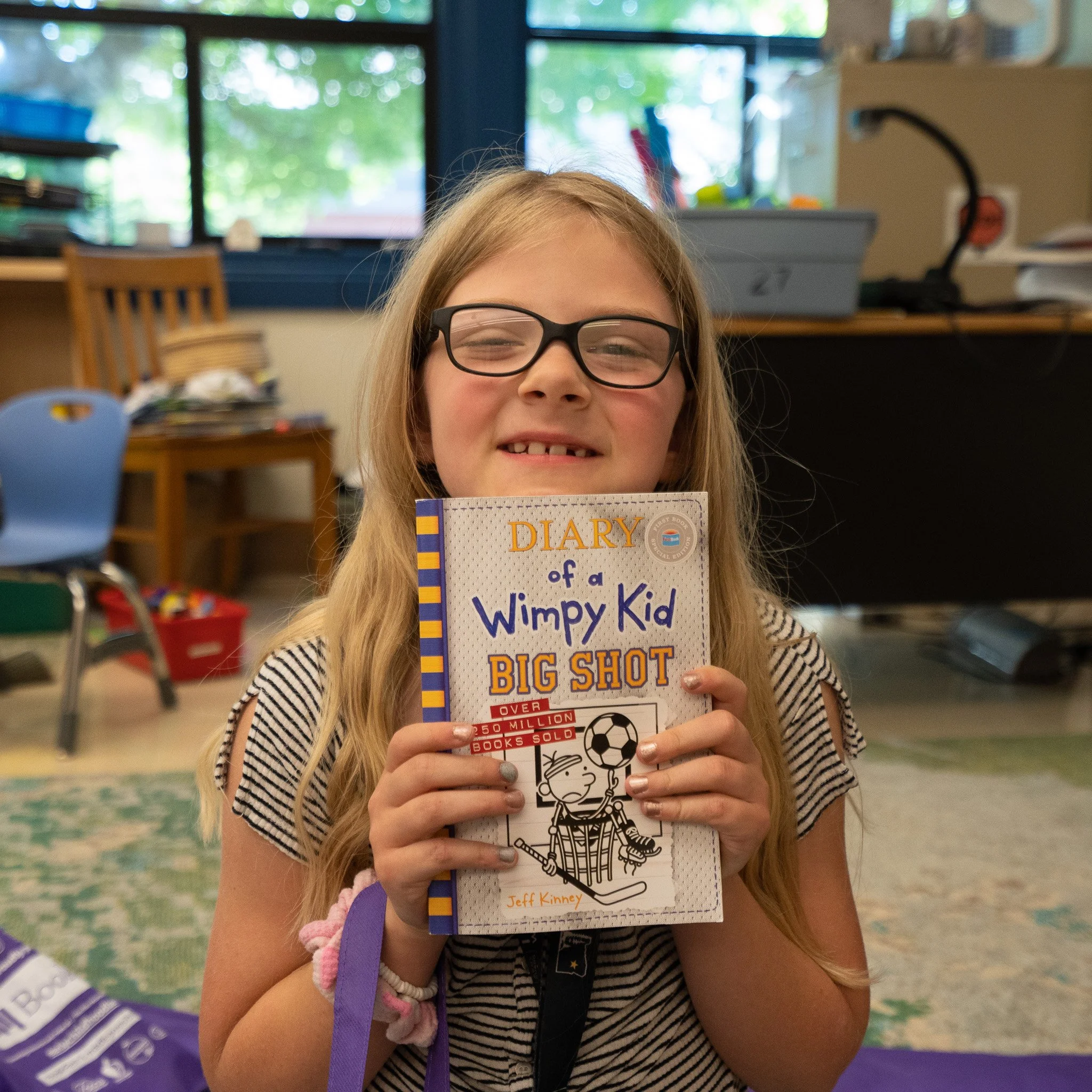 Over 2,700 K-2 students head into summer with new books, thanks to ...