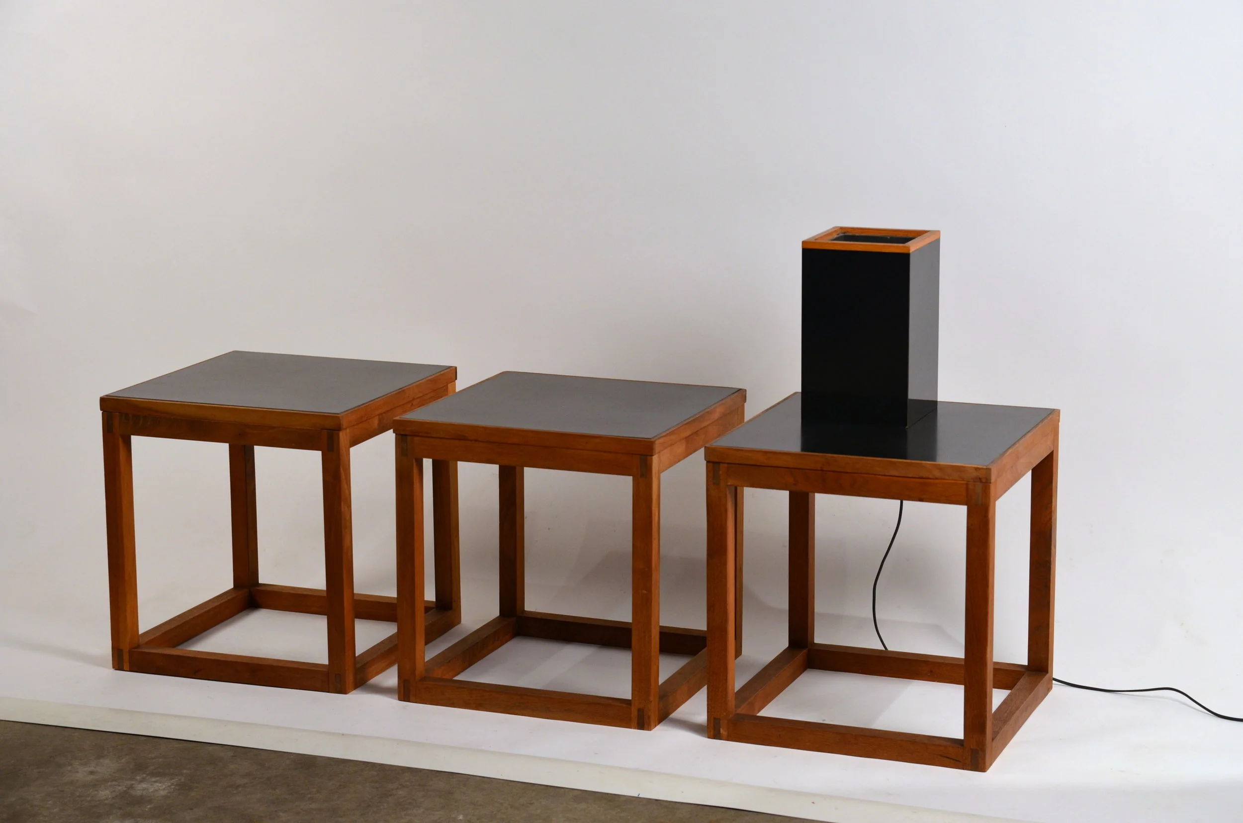 Set of 3 minimalist teak and laminate tables — Blend Interiors