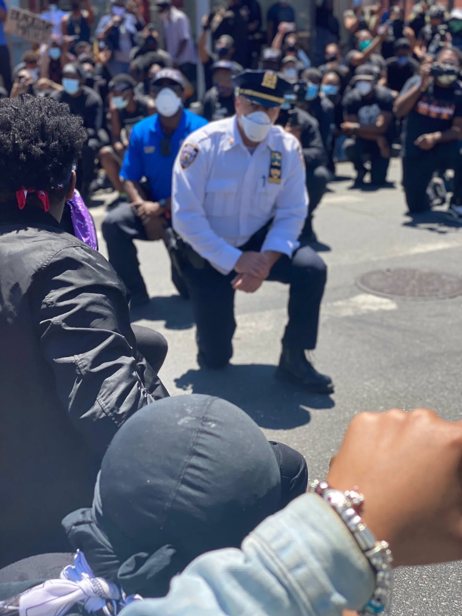 NYPD officers kneel in solidarity with Jamaica demonstrators protesting ...