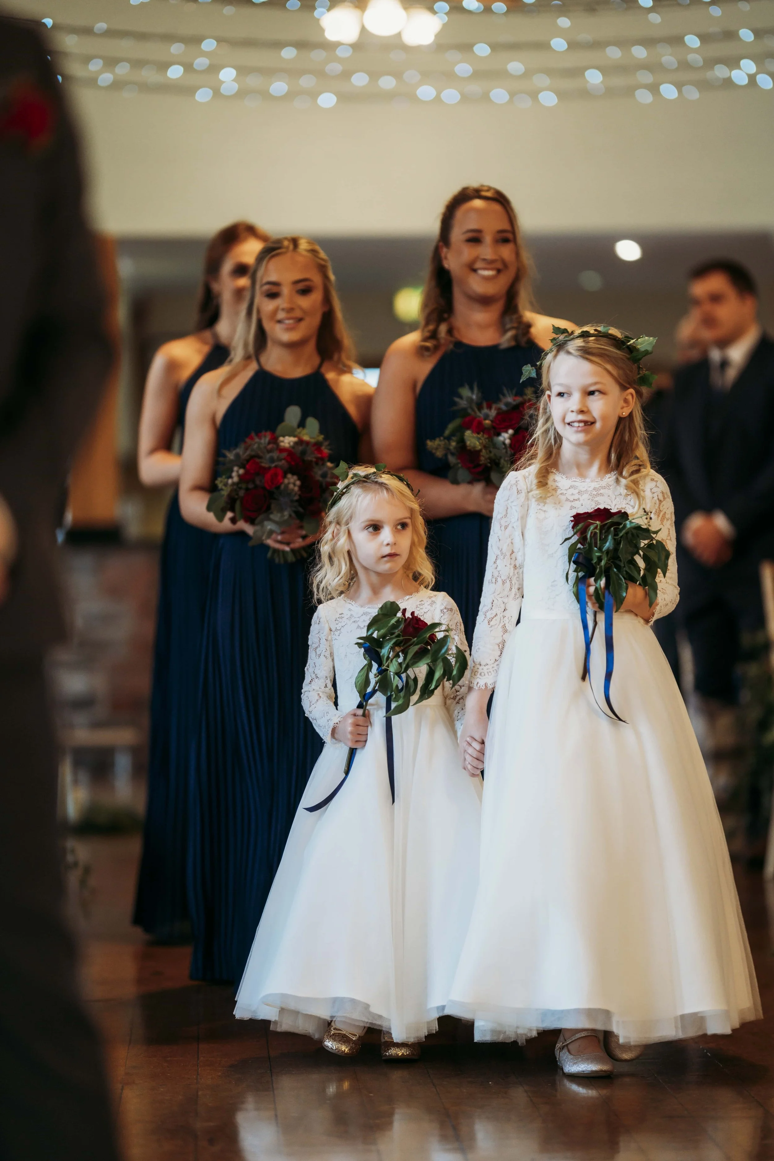 Classical winter wedding with red roses, blue thistle and seasonal ...