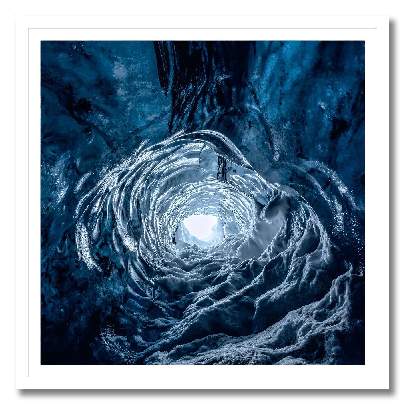 "Arctic Blue" inside an ice cave photographed by Nick Psomiadis luxury ...